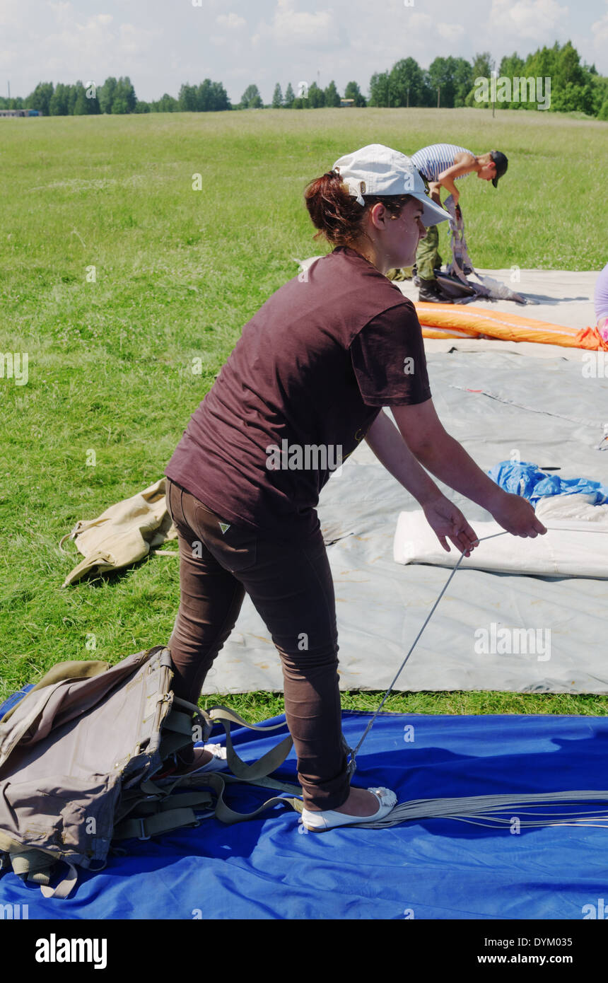 One day with parachutist in airfield. Parachute packing Stock Photo - Alamy