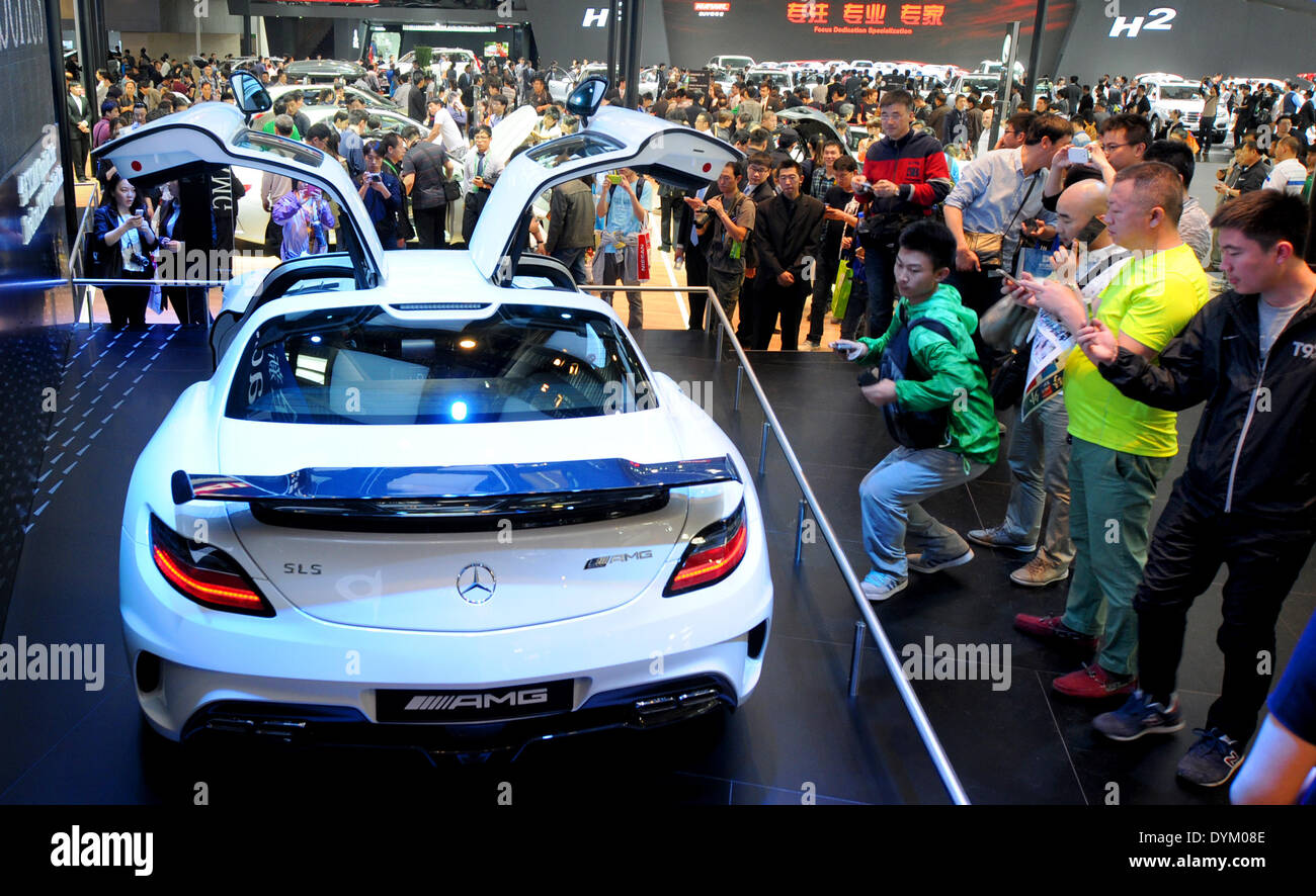 Beijing, China. 21st Apr, 2014. Visitors view the displayed automobiles ...