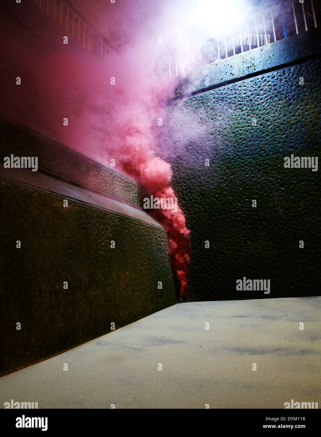 Red smoke canister being set of by the river Stock Photo - Alamy