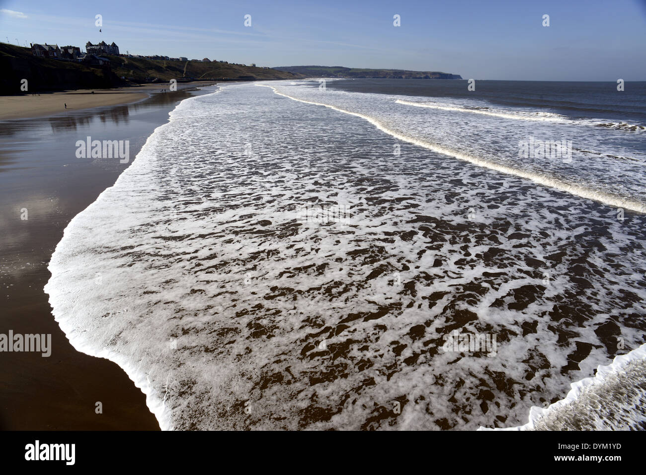 Waves form patterns on the beach at Whitby, North Yorkshire, UK ...