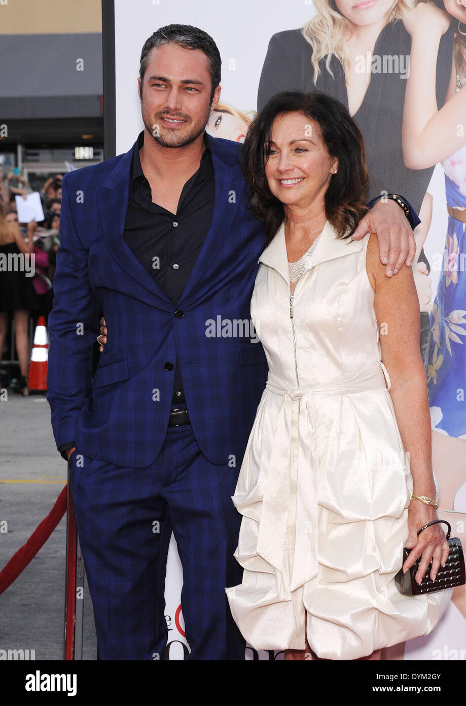 Hollywood, California, USA. 21st Apr, 2014. Taylor Kinney & Pam Kinney ...