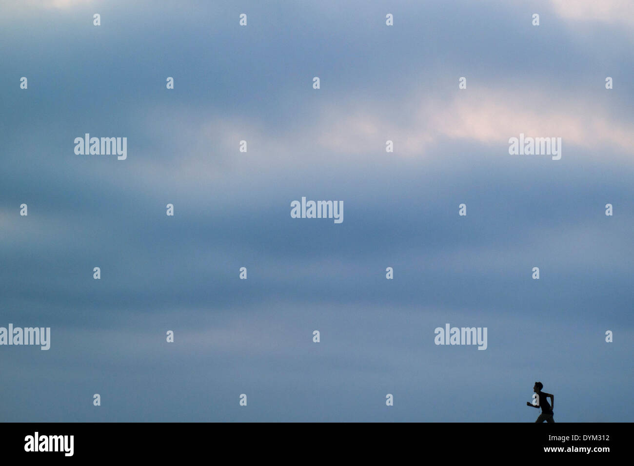 Venice, California, USA. 21st Apr, 2014. A boy runs on the beach on a ...
