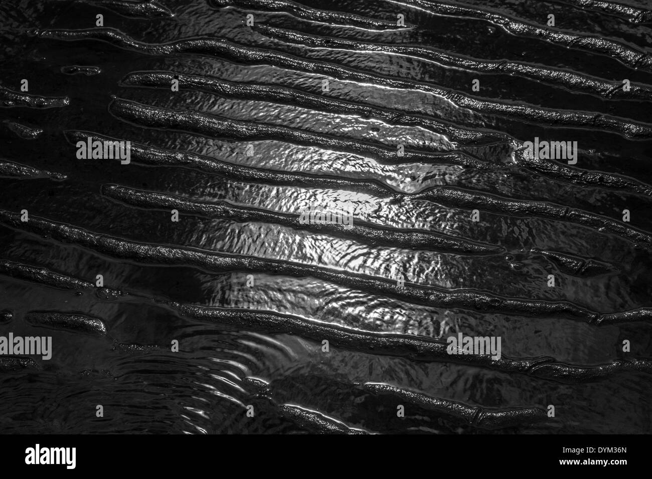 Ripples on a sandy beach shot in a moody way Stock Photo - Alamy