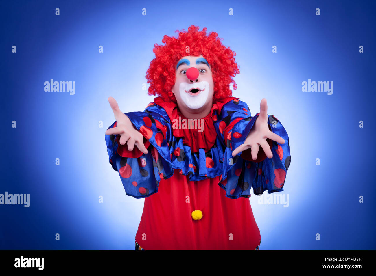 Clown men on blue background. Studio shooting Stock Photo - Alamy