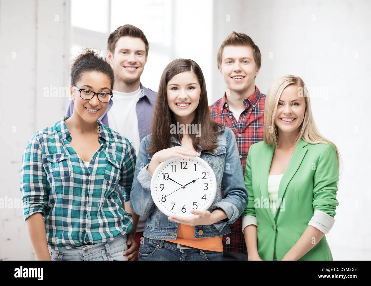 group of students at school with clock Stock Photo - Alamy