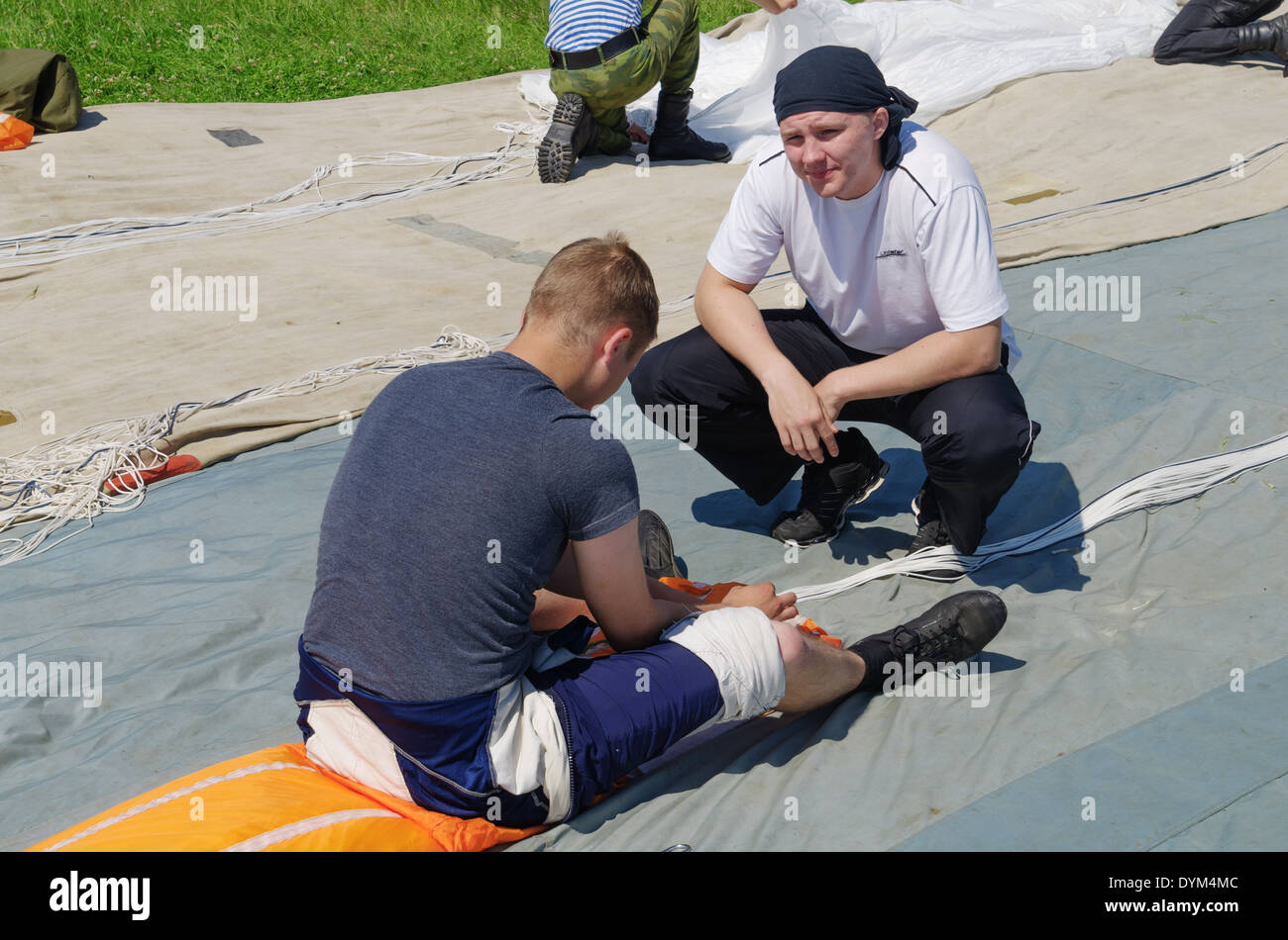 One day with parachutist in airfield. Parachute packing Stock Photo - Alamy