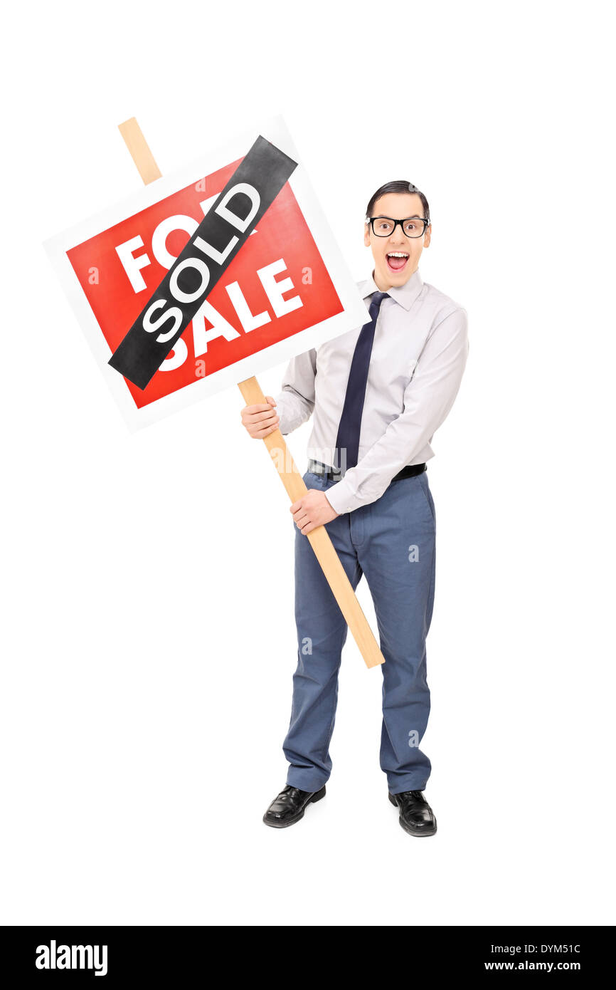 Full length portrait of a male realtor holding a sold sign Stock Photo ...