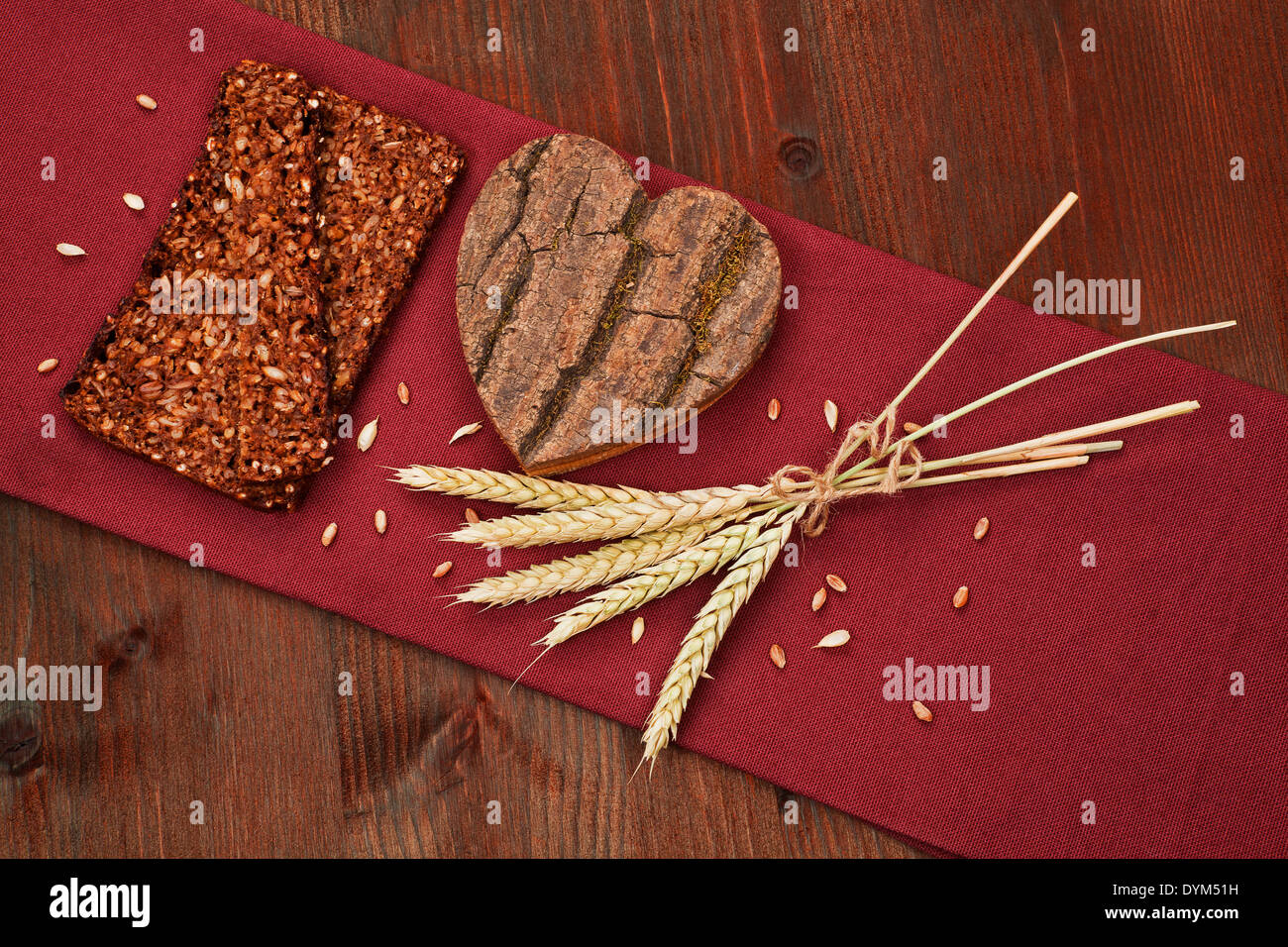 I love whole grain dark bread made of wheat, wooden heart and dark ...