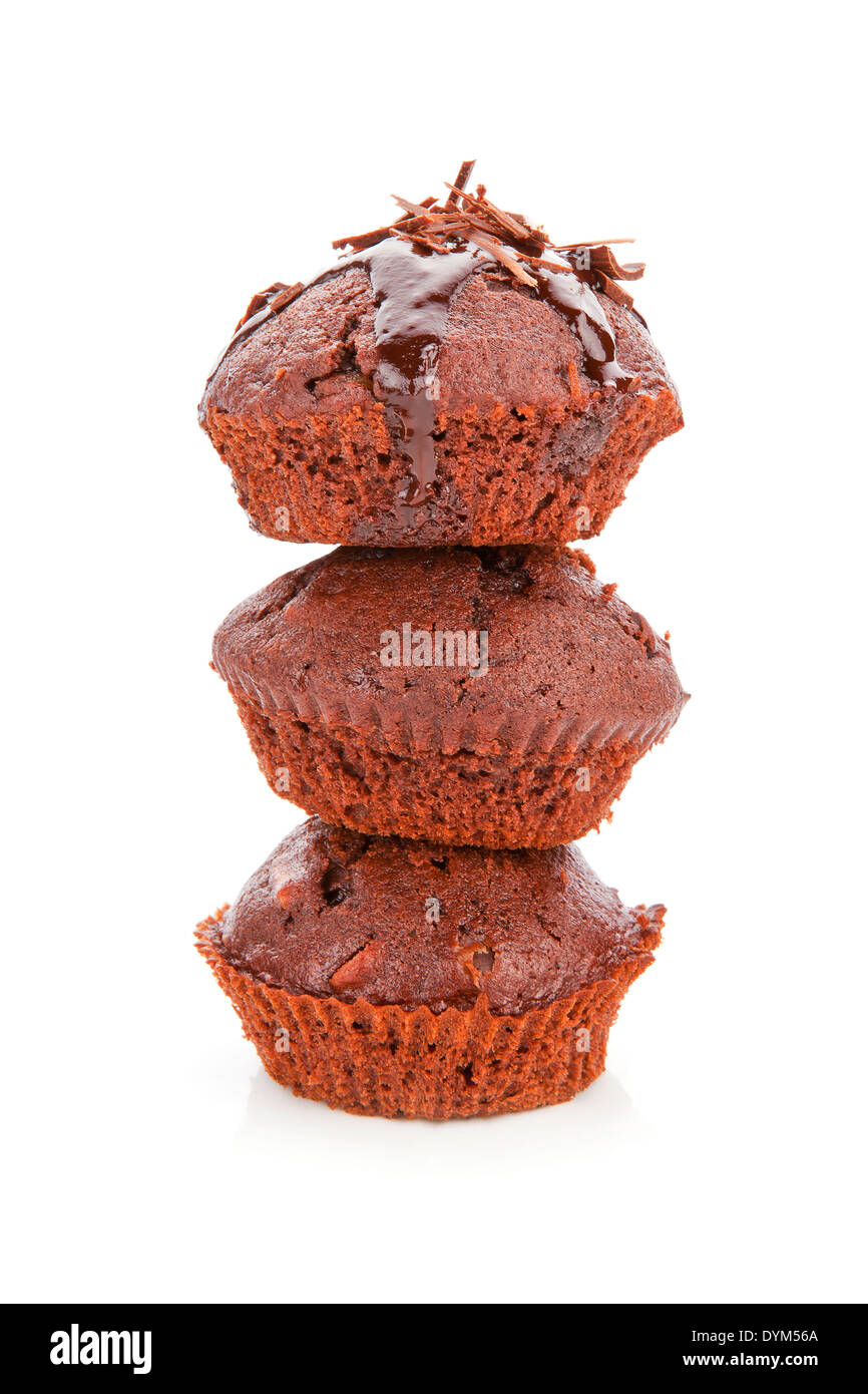 Three delicious chocolate muffins arranged on each other isolated on ...