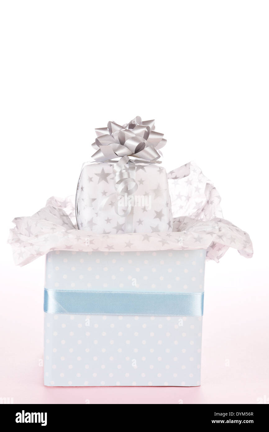 Beautiful gift box set against white and pink gradient background. It ...