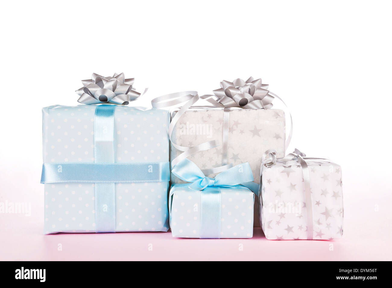 Beautiful gift box set against white and pink gradient background. It ...