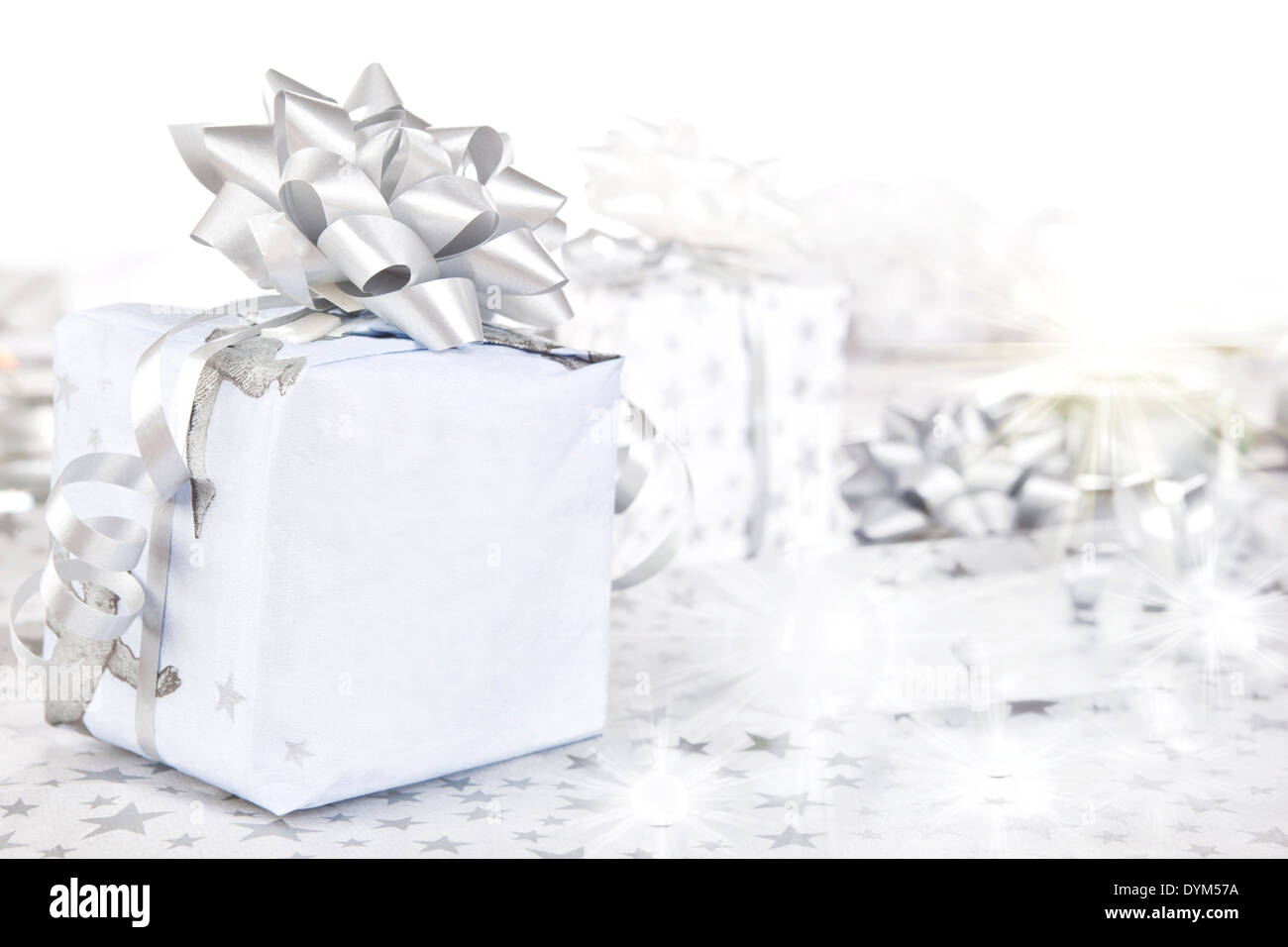 Christmas background with present, stars, light effects, candle and ...