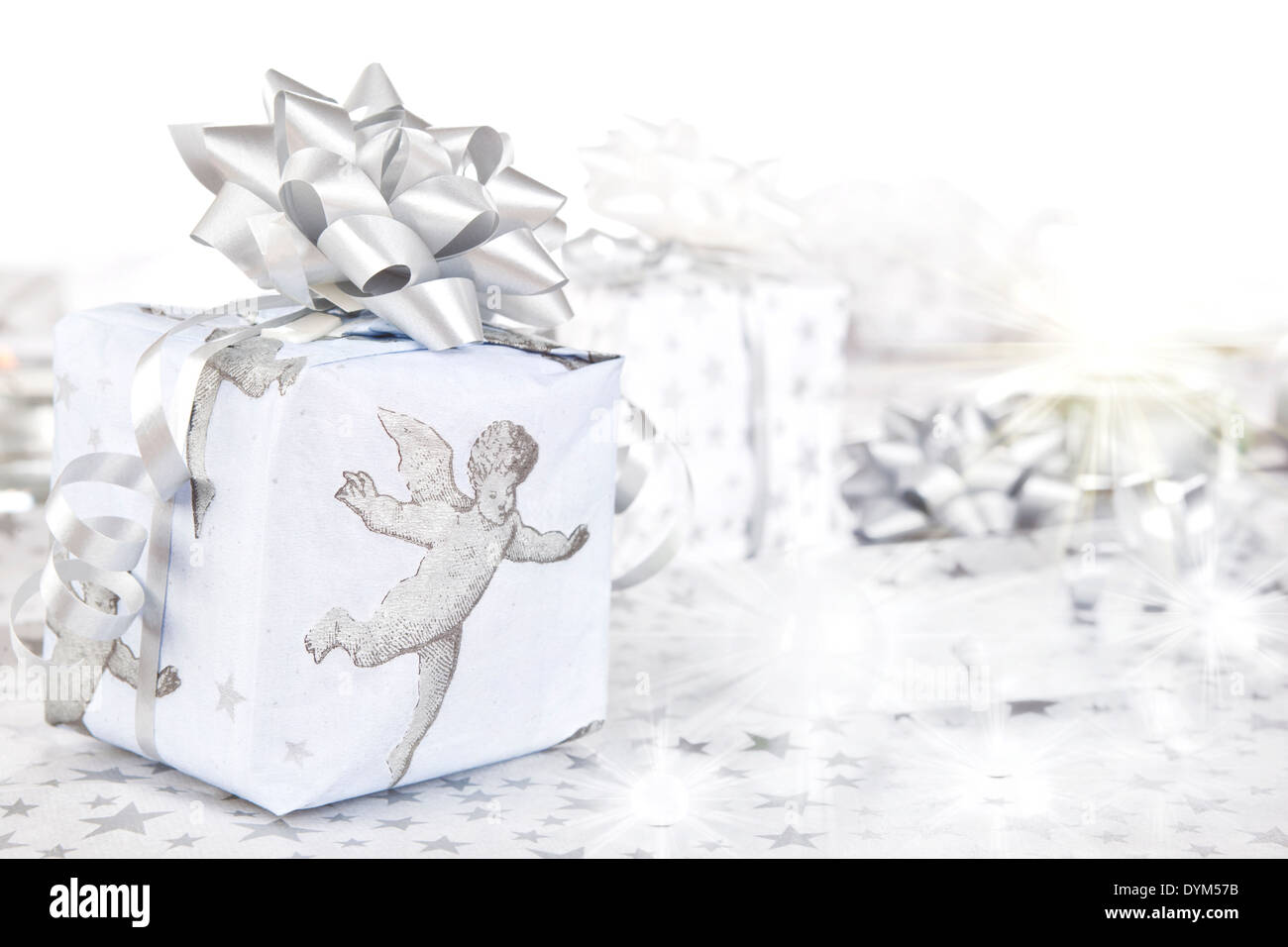 Christmas background with present, stars, light effects, candle and ...