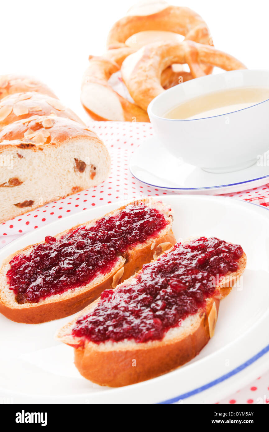 Sweet european breakfast. Traditional fruitcake with marmalade, tea in ...