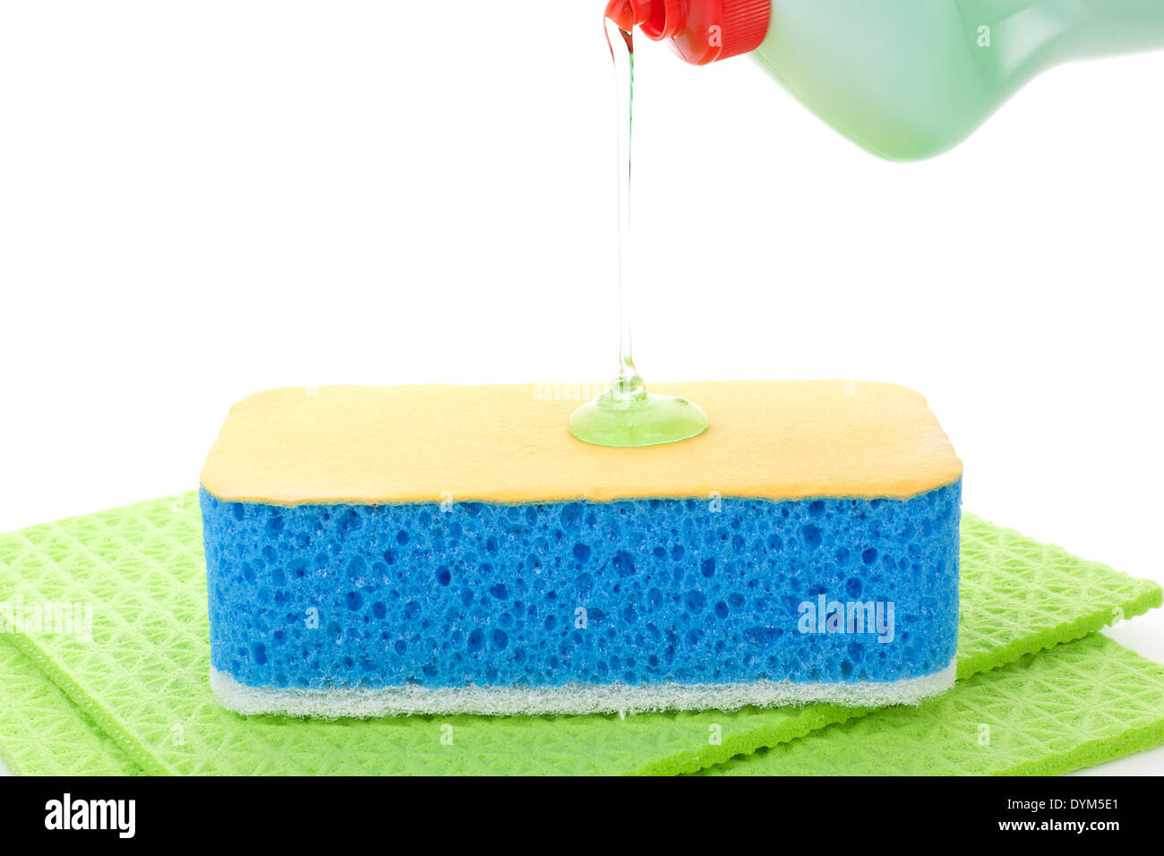 Liquid cleaner dropping onto cleaning sponge isolated on white ...