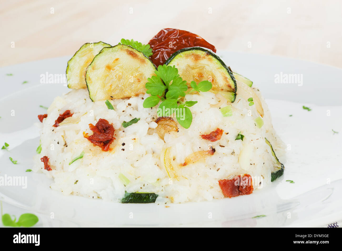 Delicious risotto with dried tomatoes and zucchini. Culinary ...