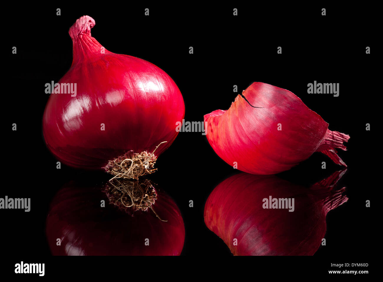 Red whole onion with peel isolated on black background. Luxurious ...