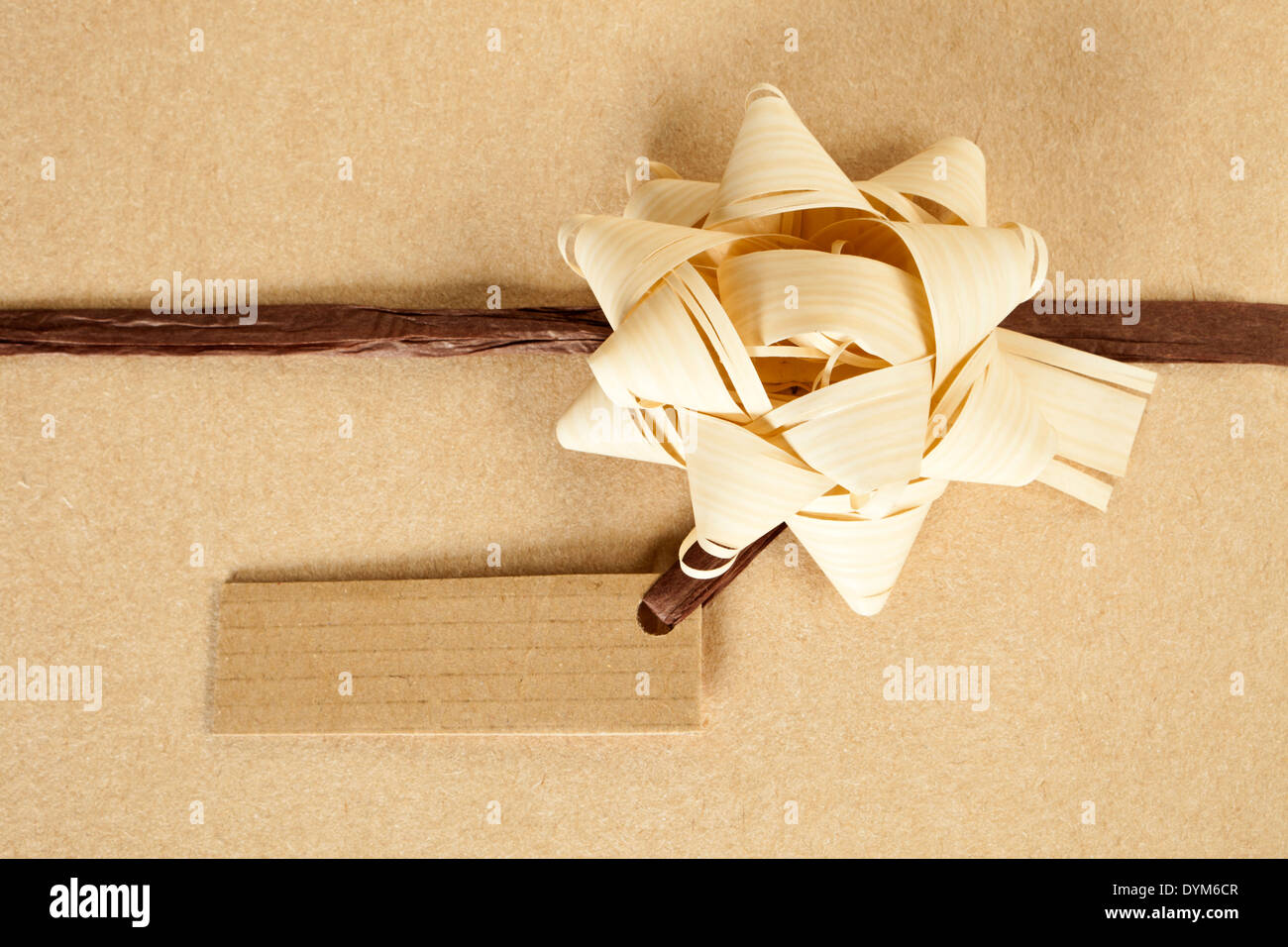 Naturally wrapped gift with blank label and copy space Stock Photo - Alamy