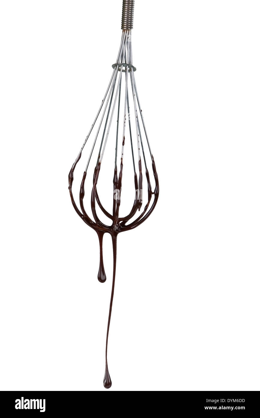 Delicious chocolate dropping from whisk isolated on white background ...