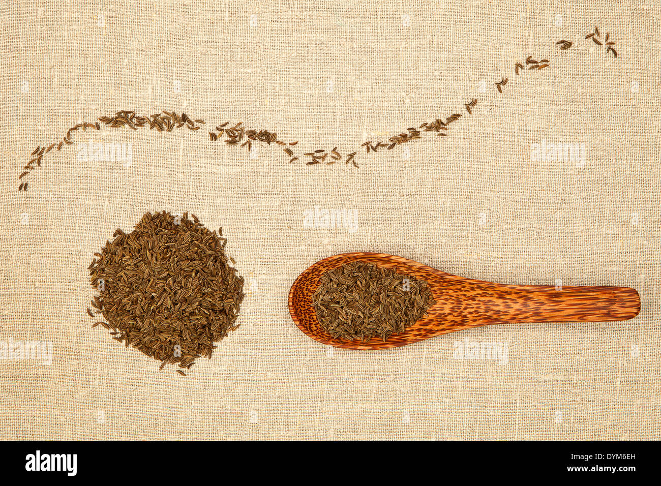 Cumin seeds decorative arranged on brown background Stock Photo - Alamy