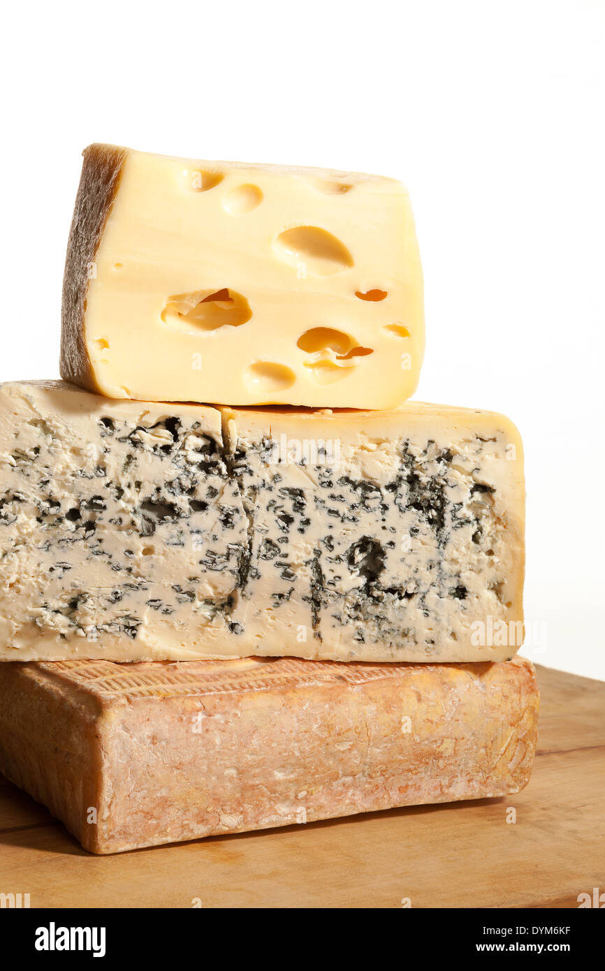 Three huge various cheese block on wooden background. Culinary cheese ...