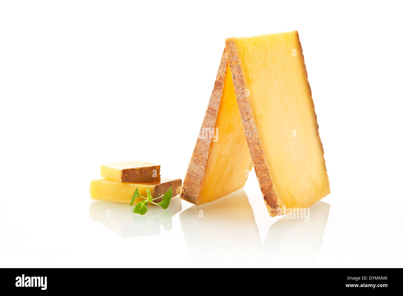 Luxurious cheese slices and pieces arranged on white background Stock ...