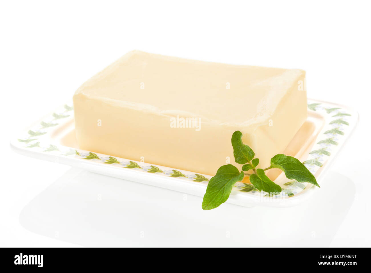 Fresh butter with fresh herbs on butter tray isolated on white ...