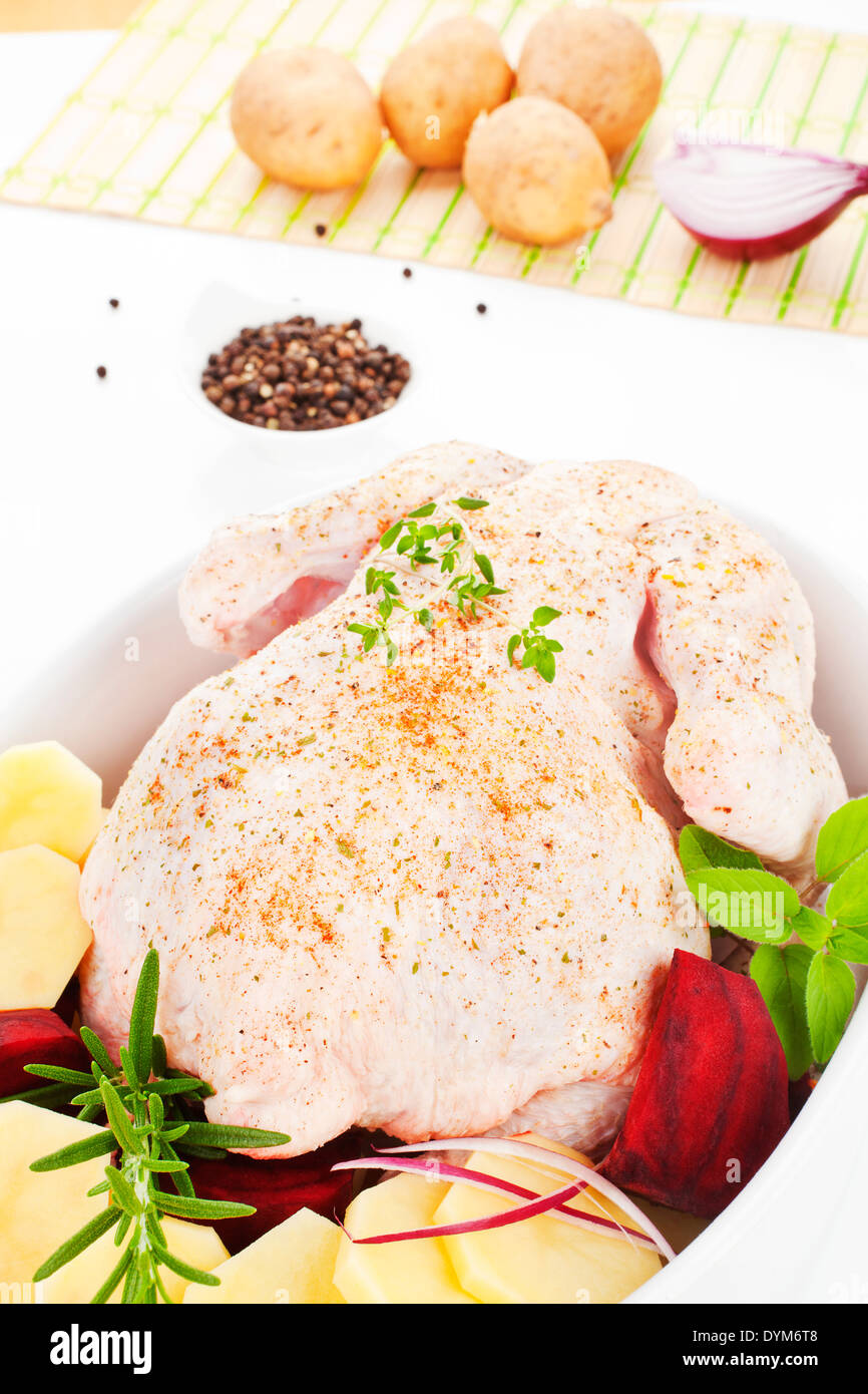 Delicious chicken with fresh herbs and vegetable in baking dish ...