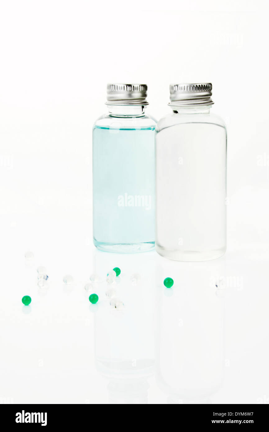 Shampoo and shower gel in transparent bottles isolated on white ...