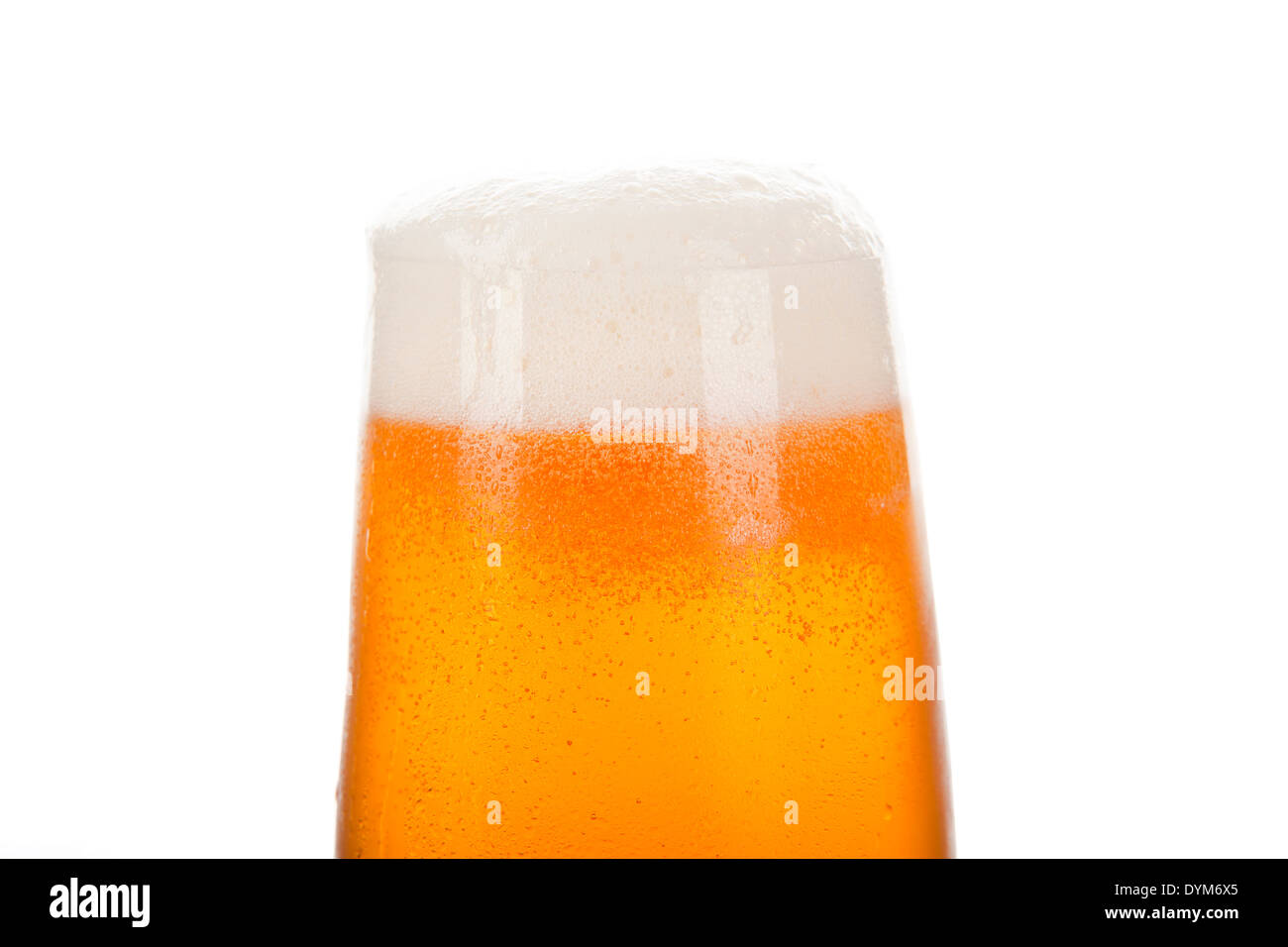 Lager beer in glass with froth isolated on white. Hot summer background ...