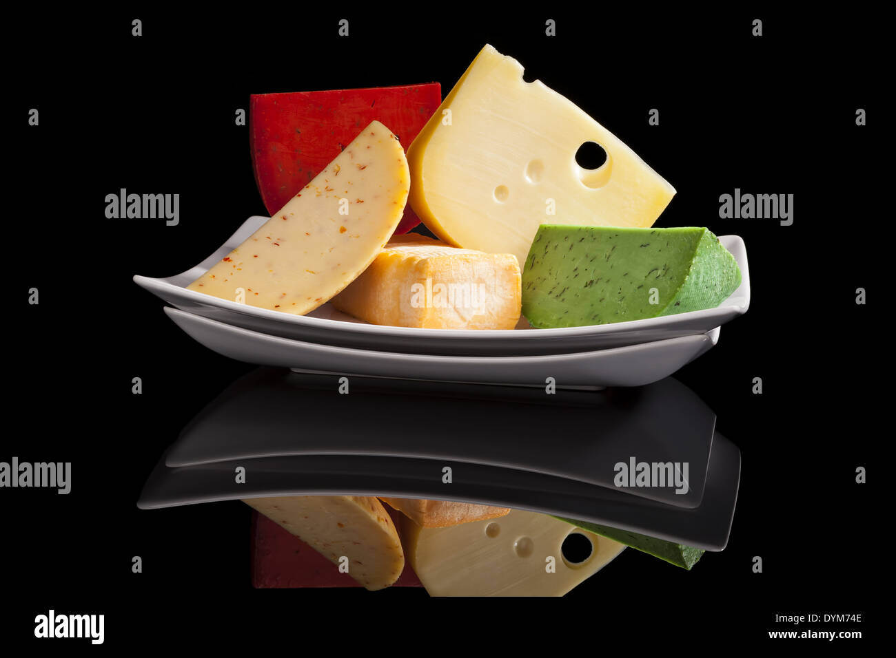Colorful culinary cheese variation on black background. Gourmet cheese ...