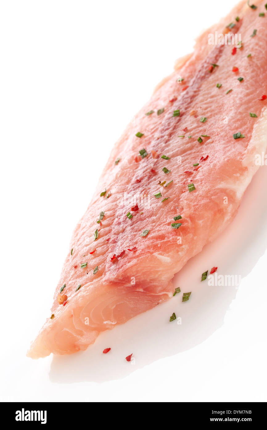 Raw fish fillet with herbs isolated on white background. Culinary ...