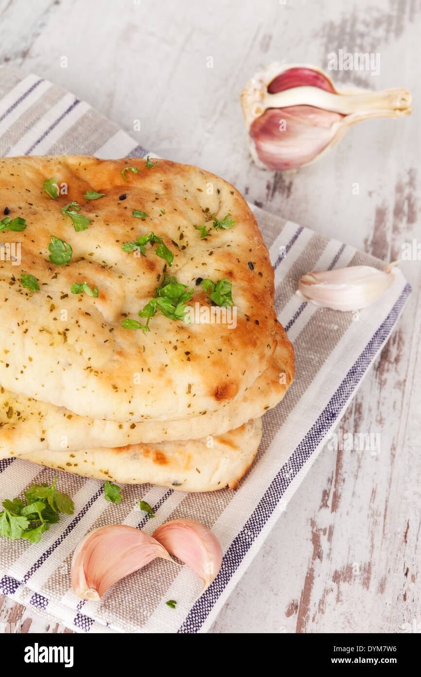 Luxurious naan flatbread background. Naan stack with fresh cilantro and ...