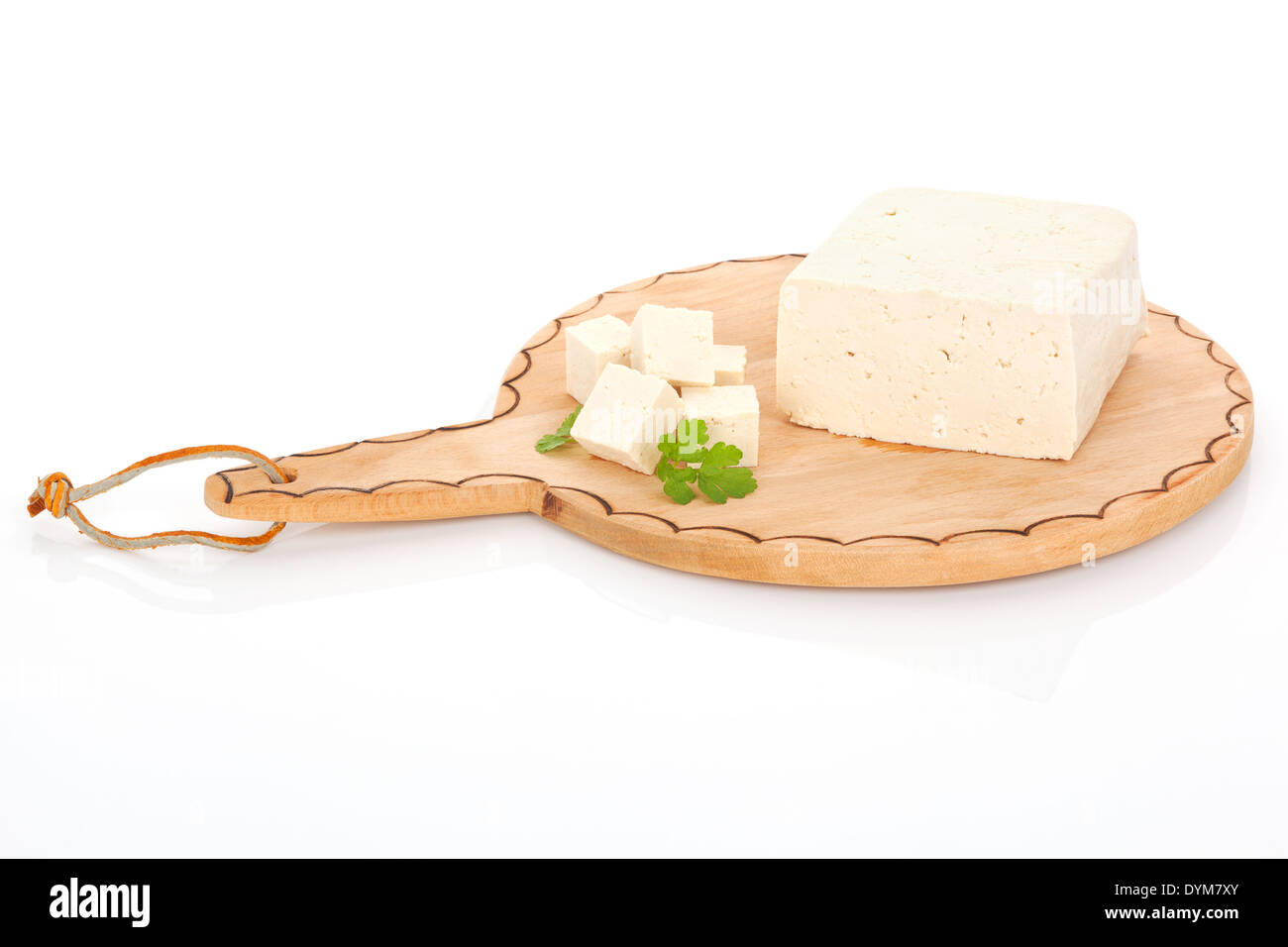 Tofu on wooden round vintage cutting board isolated on white background ...