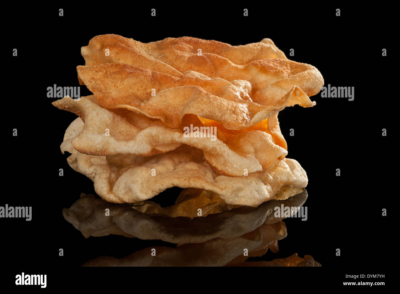 Pappadum stack isolated on black background. Culinary eastern cuisine ...