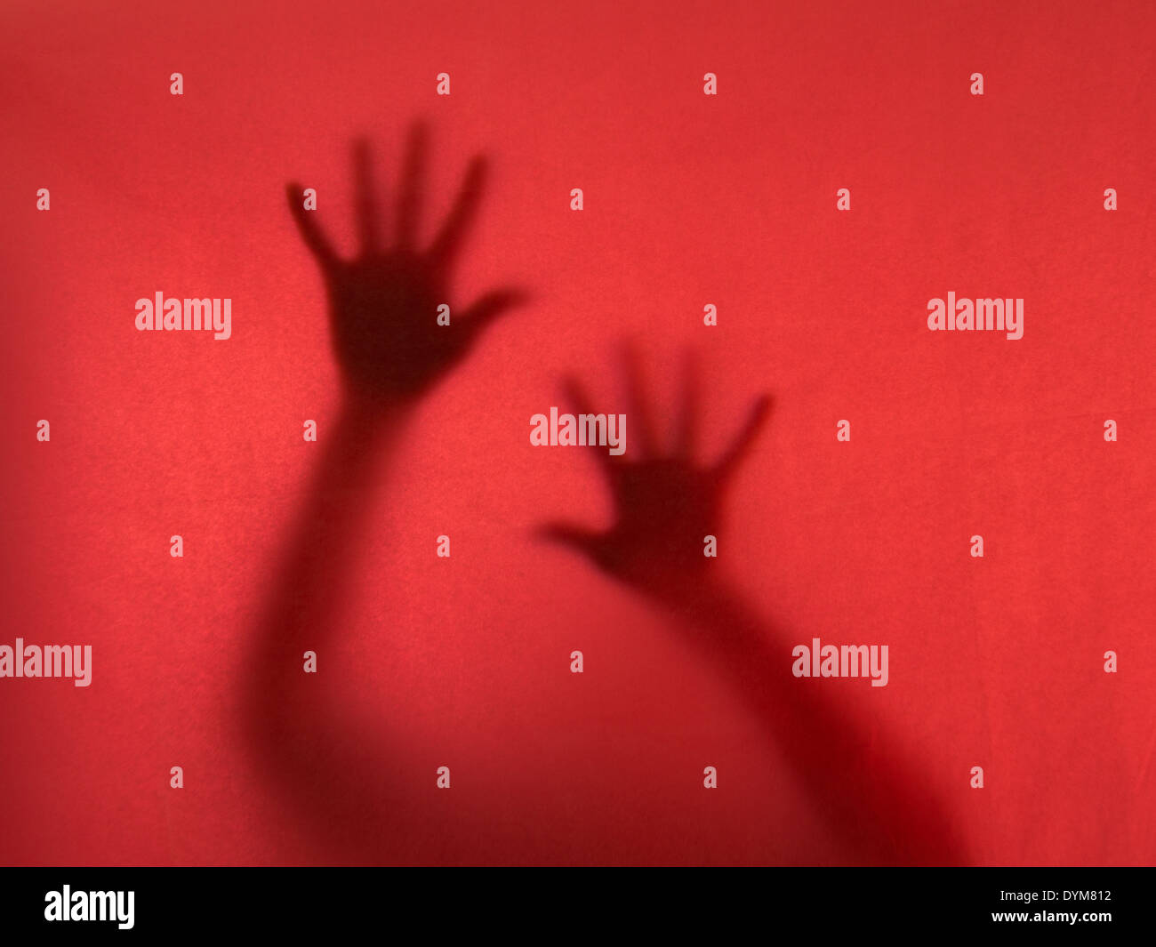 Trapped. Ghostly hands reach out to the camera Stock Photo - Alamy