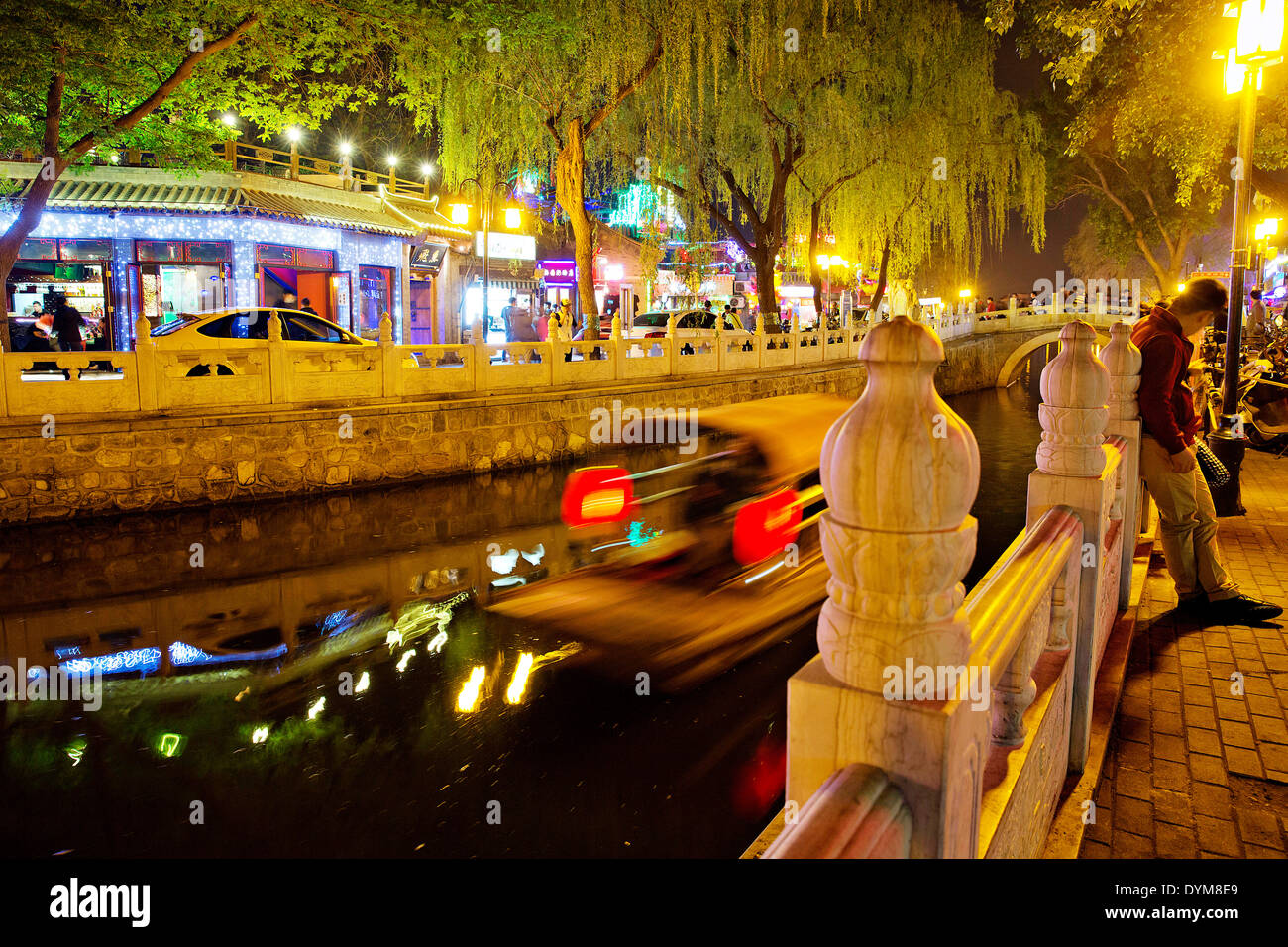 Thousands of locals and visitors of Beijing enjoy night life at Chou ...