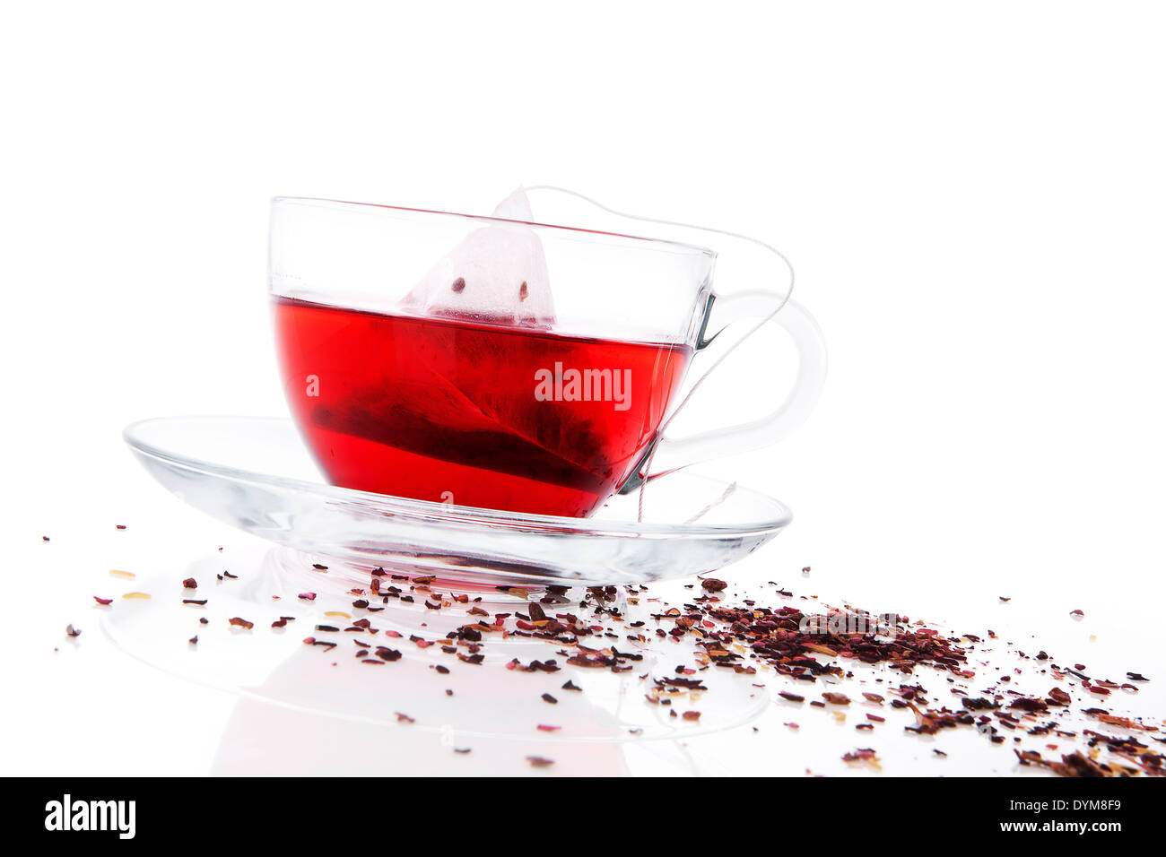 Red fruit tea in transparent tea cup with tea bag. Dried tea in ...