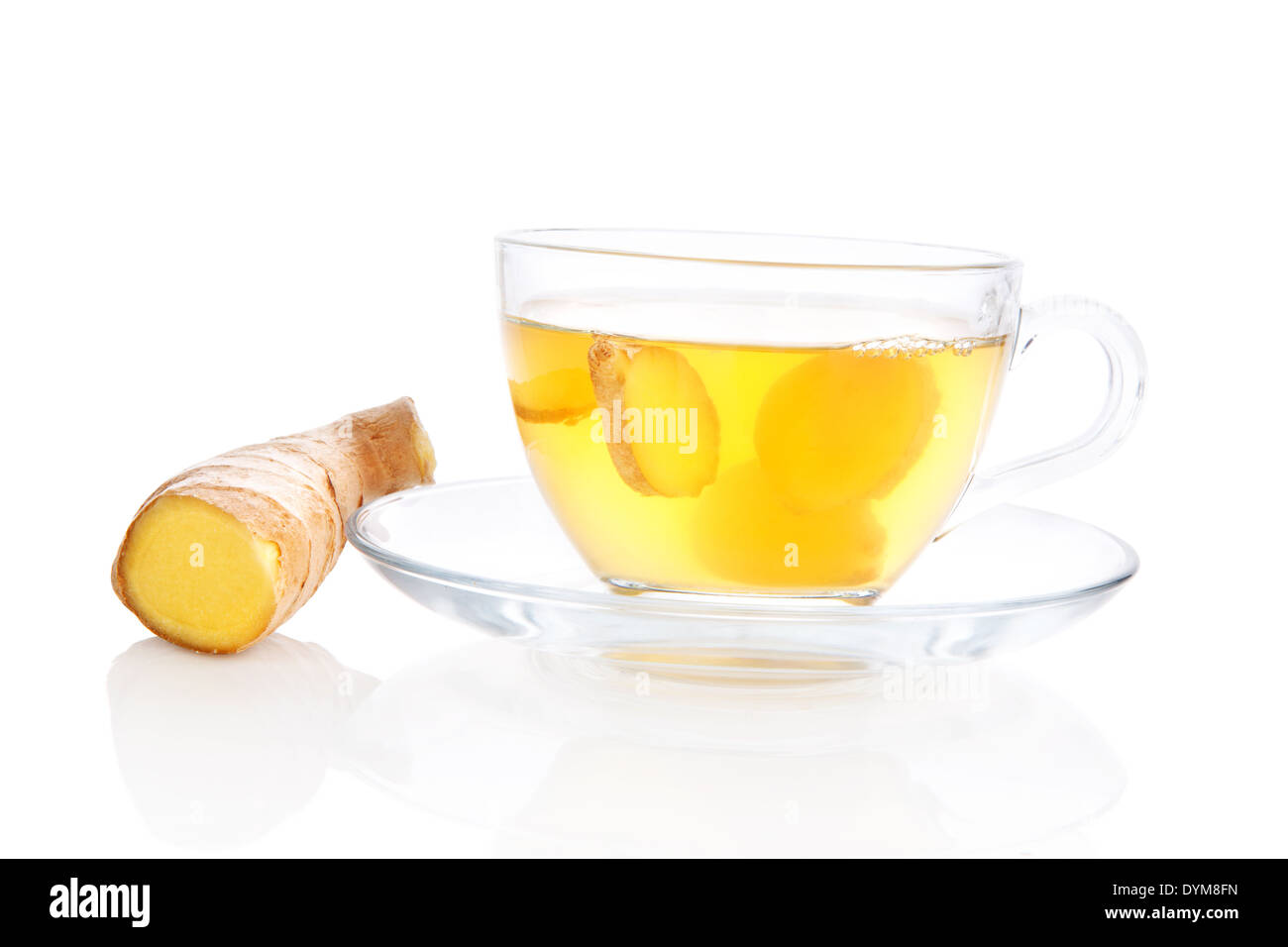 Delicious ginger tea in transparent tea cup with saucer and ginger root ...