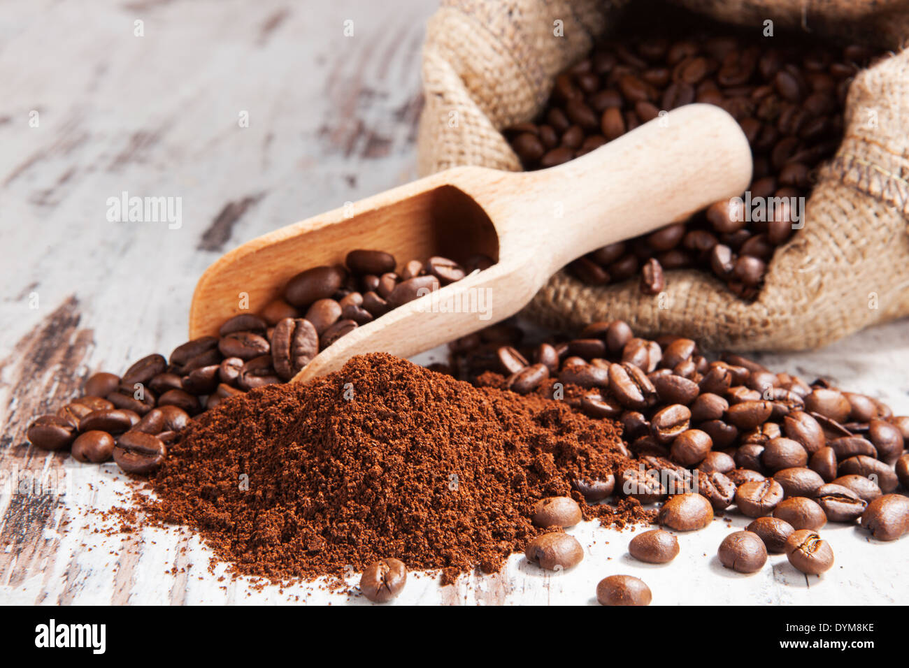 Traditional coffee background. Ground coffee and coffee beans on white ...