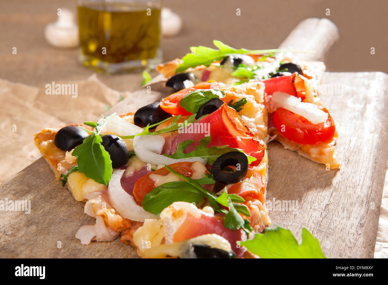 Delicious pizza piece with various toppings close up. Traditional ...