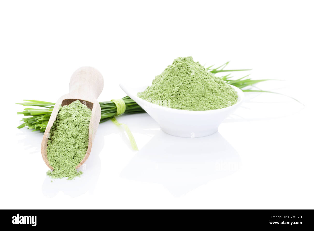 Luxurious wheat grass still life. Ground wheat grass powder on wooden ...