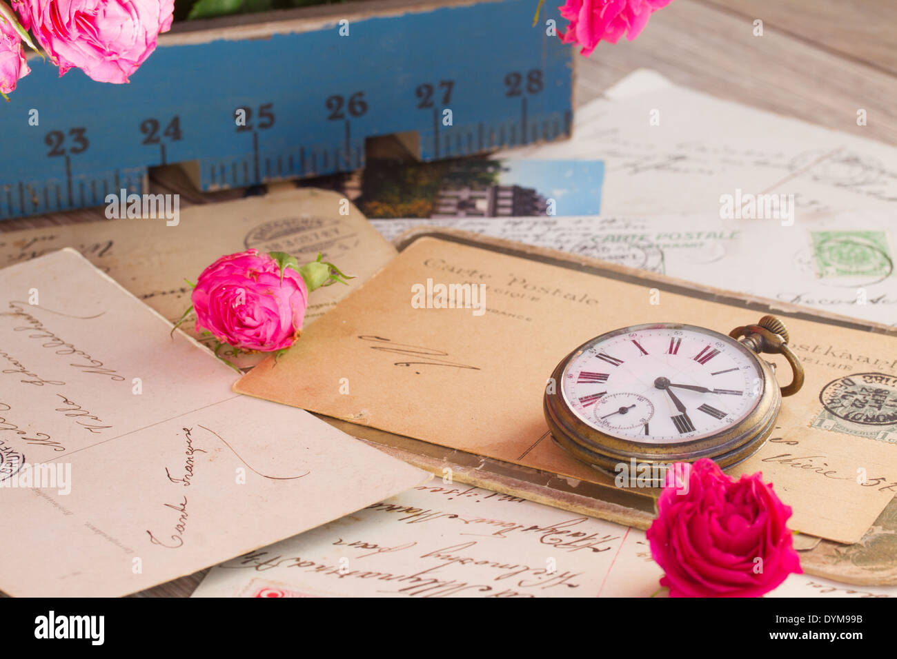 old pile of mail and antique clock Stock Photo - Alamy