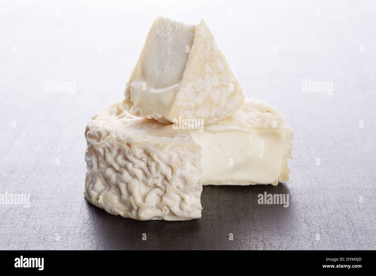 Delicious goat cheese on dark grey background. Culinary cheese eating ...