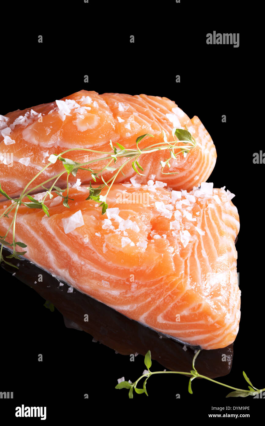 Luxurious salmon background. Fresh raw salmon piece isolated on black ...