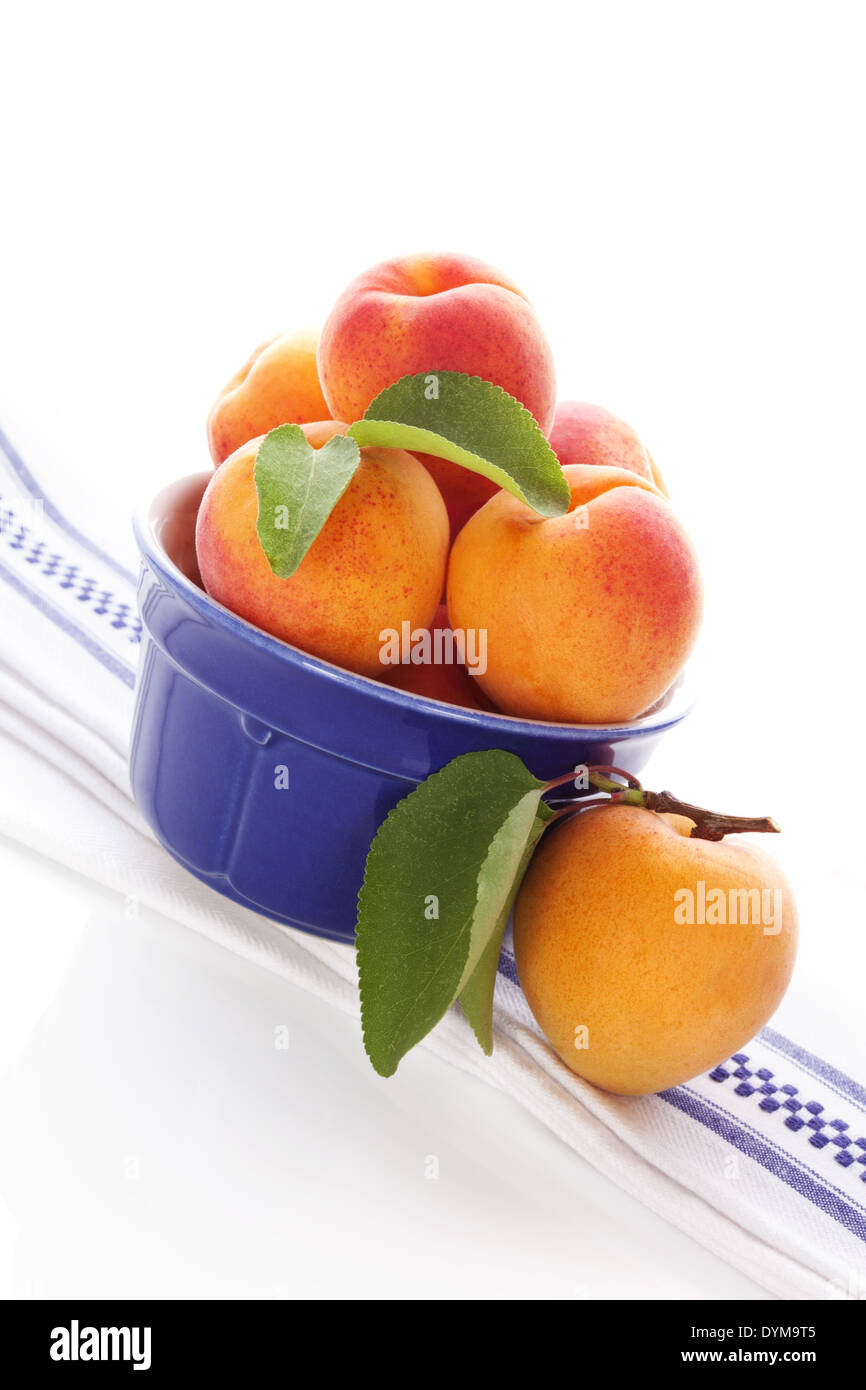 Apricots background in white and blue, modern minimal style. Healthy ...