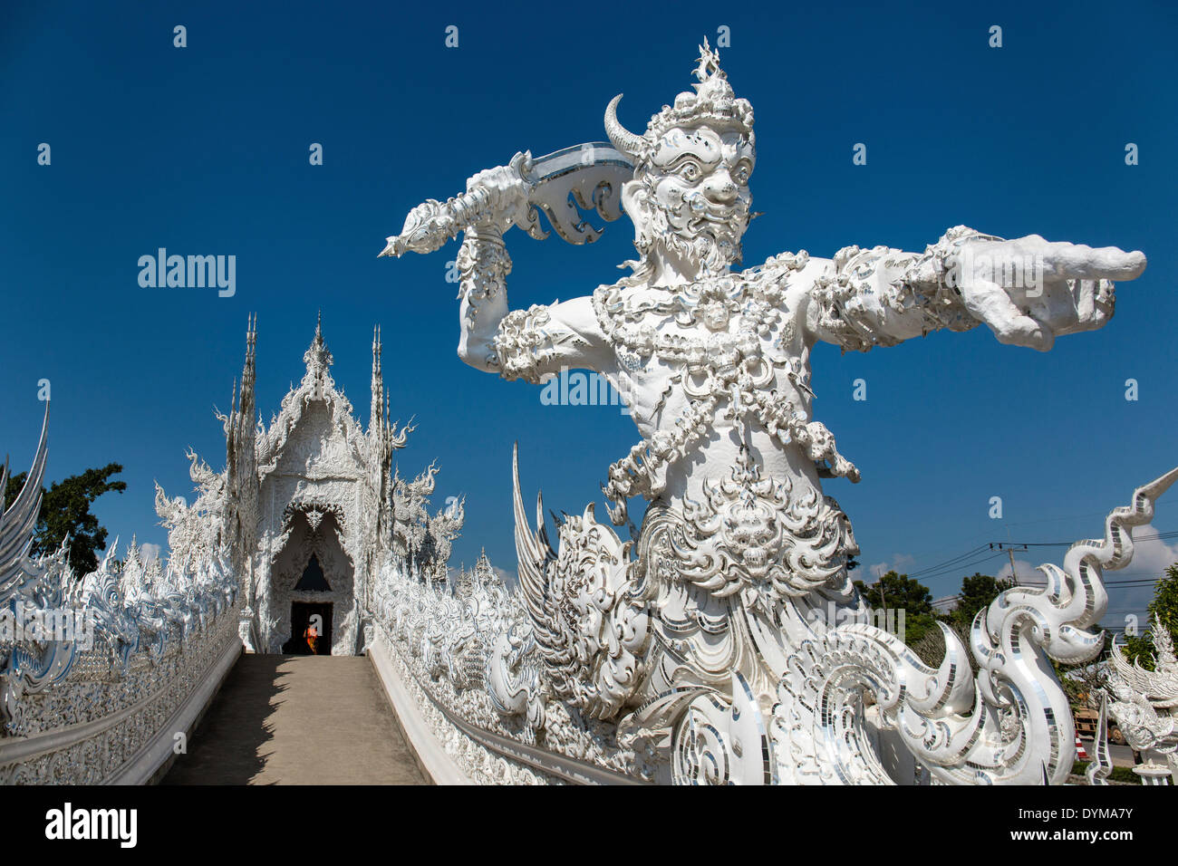 Wat Rong Khun, ornate guardian and demon on the bridge of the White ...