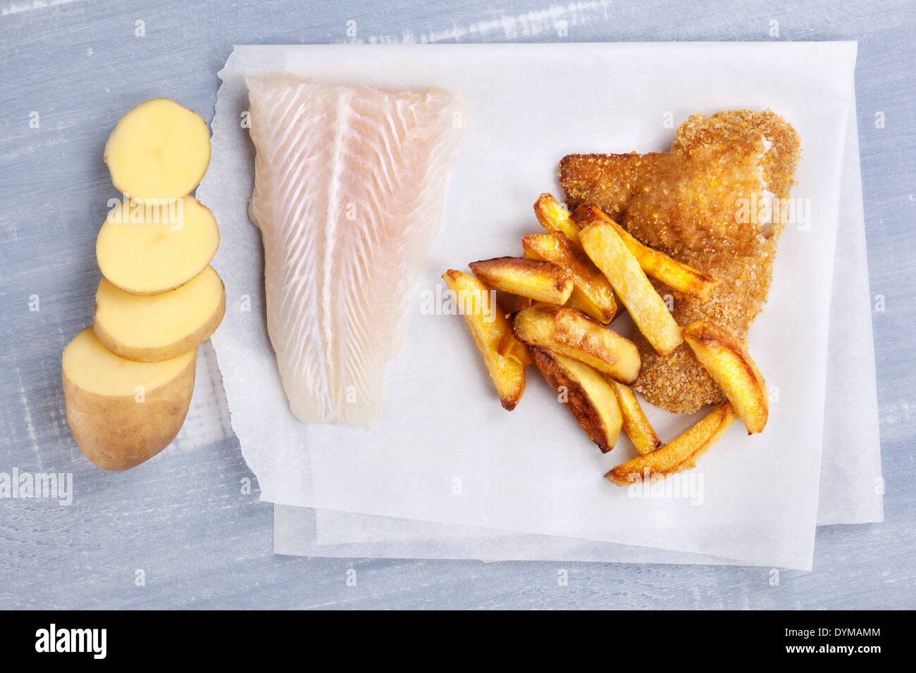 Traditional seafood eating. Raw uncooked fish fillet, fish and chips on ...