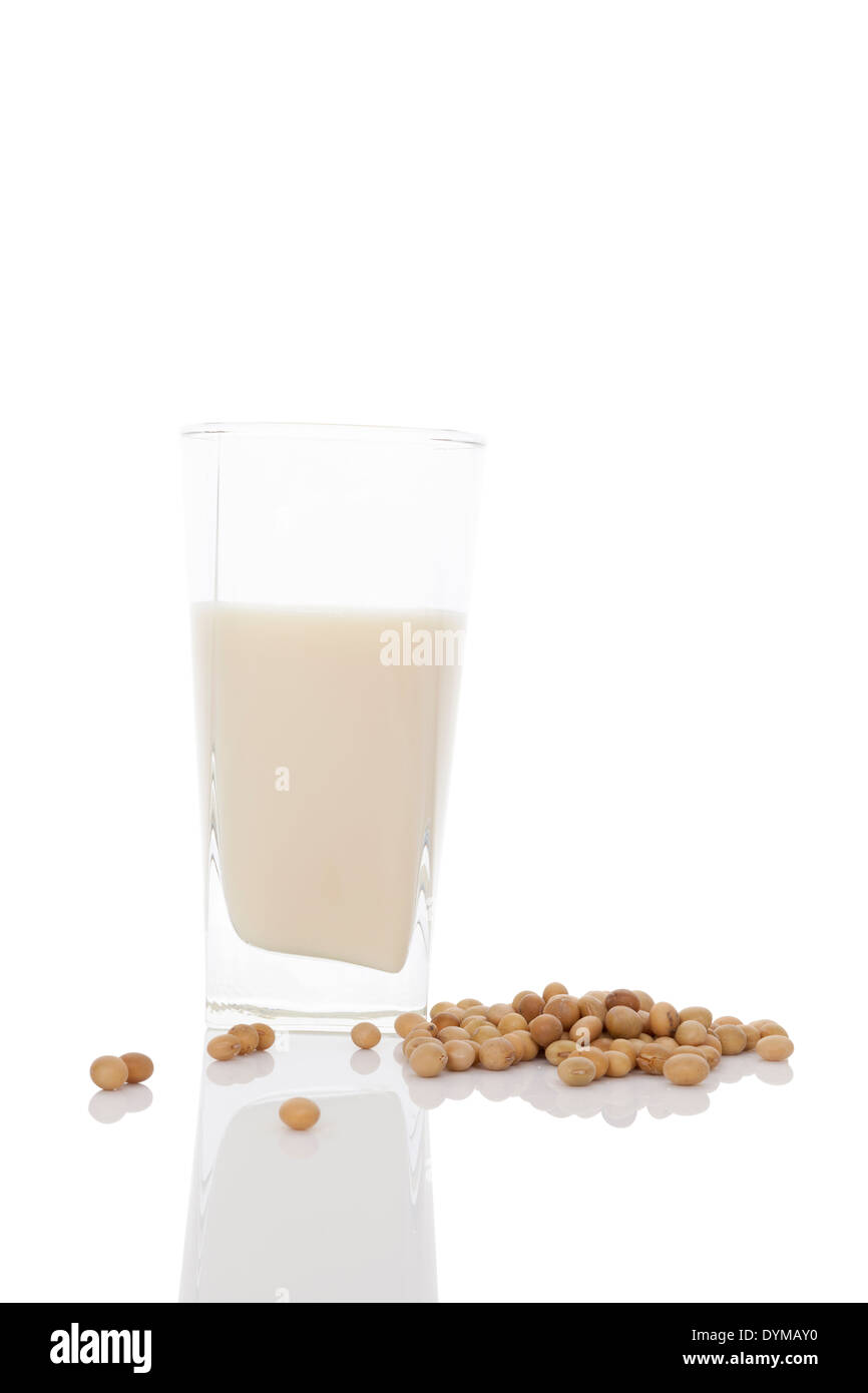 Glass of organic soya milk with soya beans isolated on white background ...