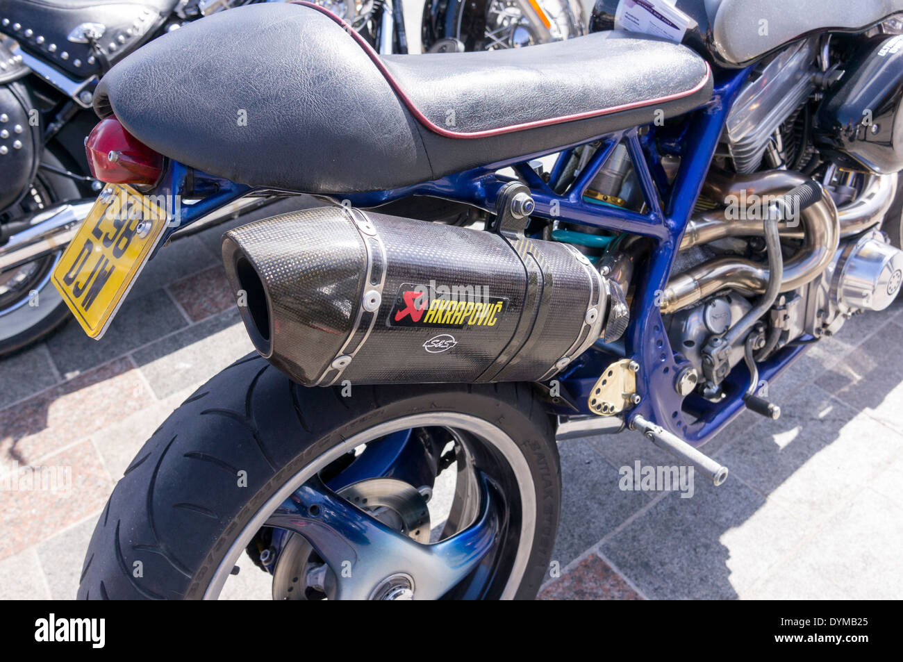 Custom motorcycle exhaust silencer and seat Stock Photo - Alamy